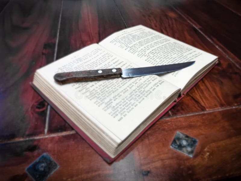 Old Knife and a Book on the Table,detective Crime Investigation Concept ...