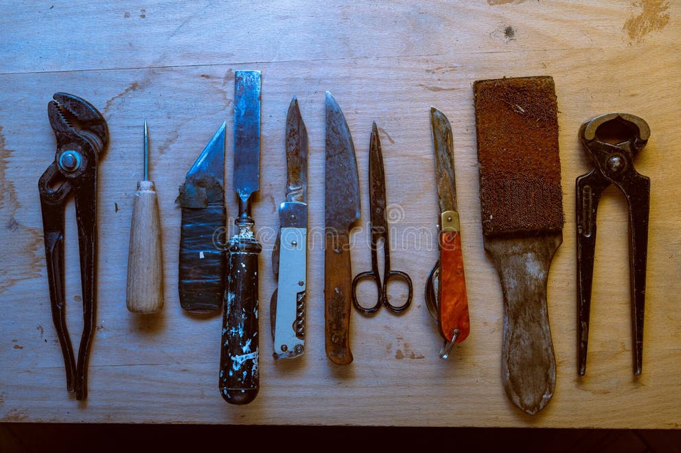 Old Knives and Tools on the Table. Old Soviet Instruments. Rusty Tools ...