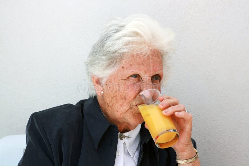Old Lady Drinking Orange Juice Stock Image - Image of elderly, drink ...
