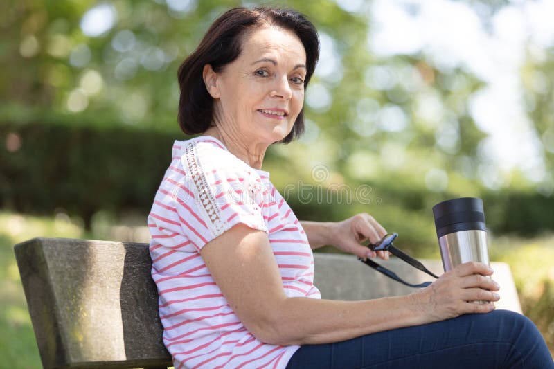 Old Lady Drinking Tea Sitting on Bench in Sunny Park Stock Photo ...