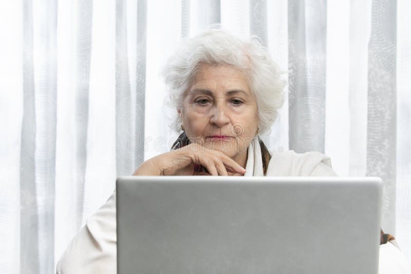 Old Lady Glasses Looking At A Computer On A Wooden Table Stock Photo ...