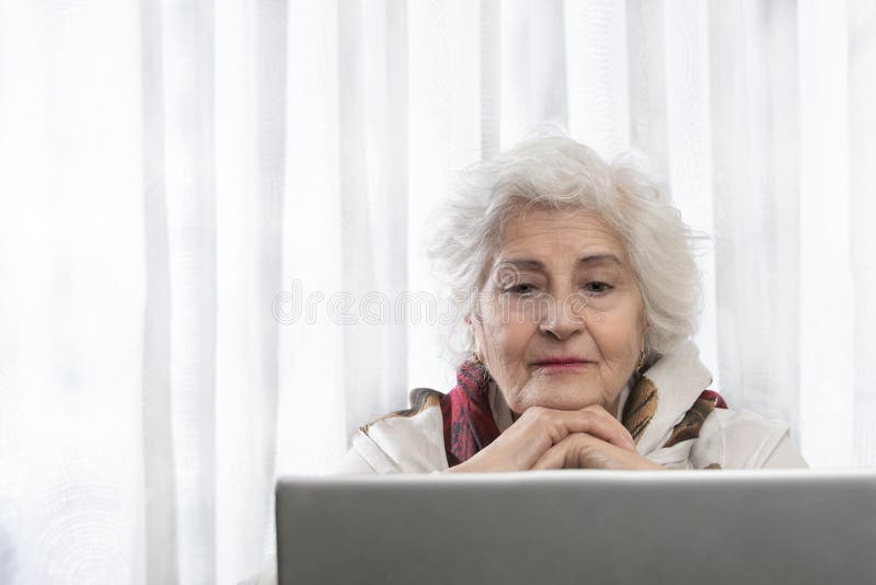 Old Lady Looking at a Computer on a White Table Stock Photo - Image of ...