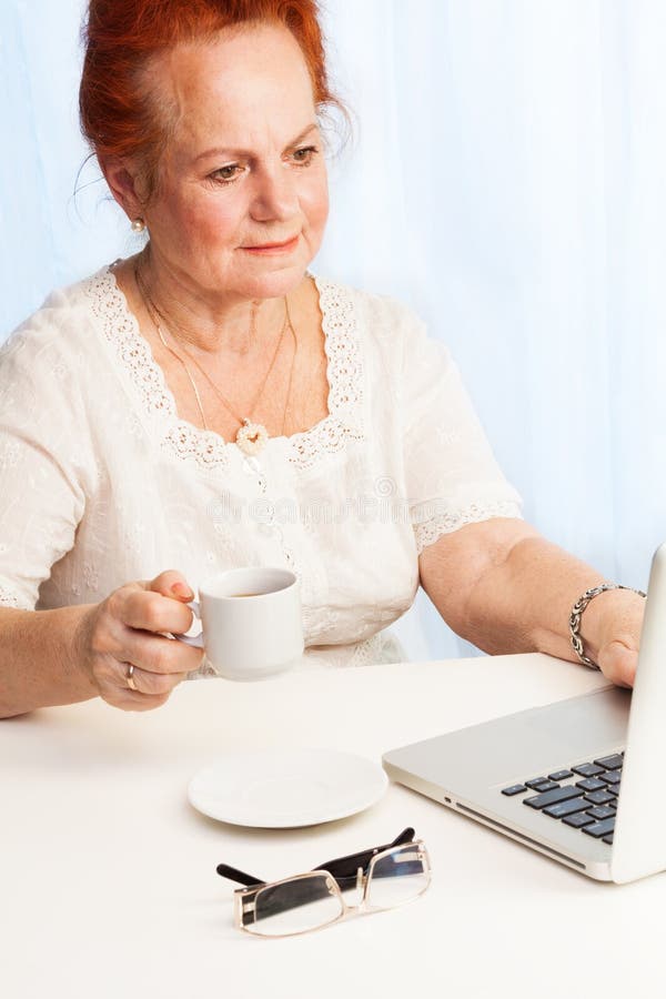 Old lady reading her email stock photo. Image of aged - 27393246