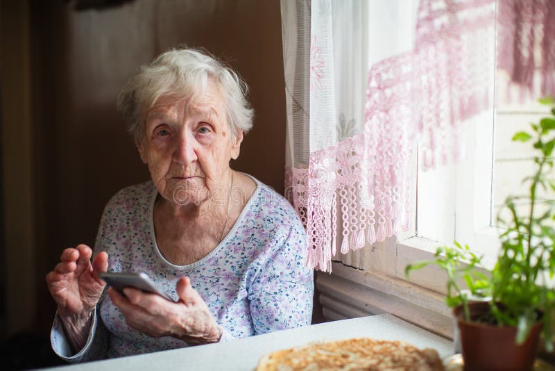 Old Lady Sits and Typing on Smartphone. Technology Stock Photo - Image ...