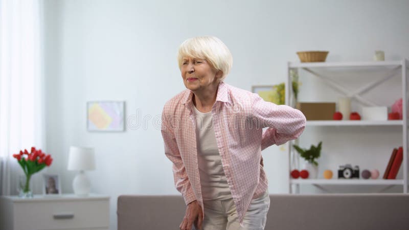 Old Lady Standing Up from Sofa Suddenly Feeling Sharp Lower Back Pain ...