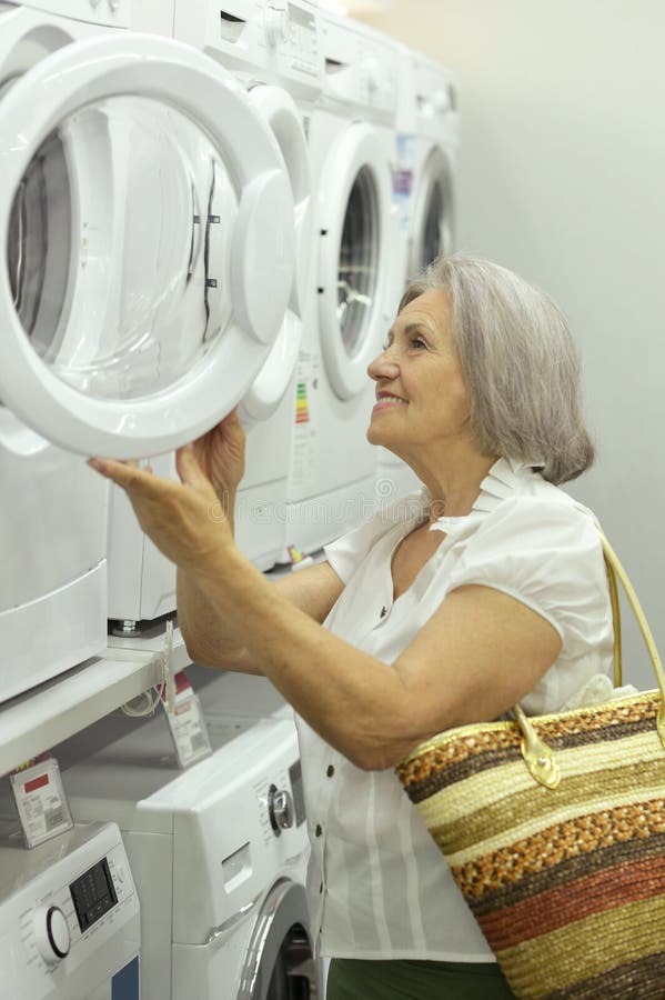 Old lady in store stock image. Image of machine, looking - 46586477