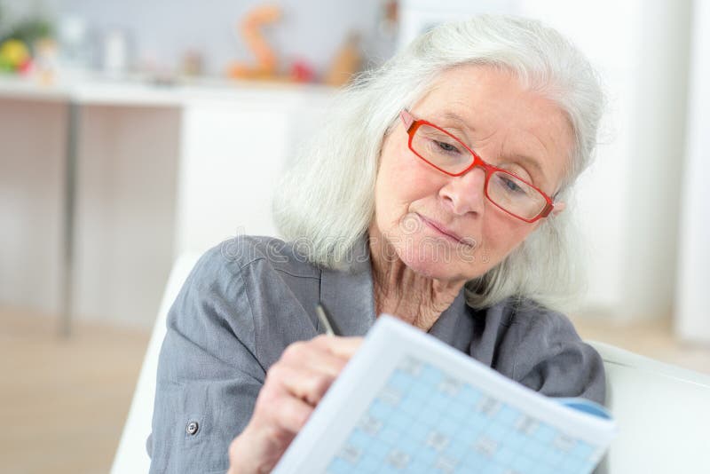Old lady taking notes stock photo. Image of elderly - 277100170