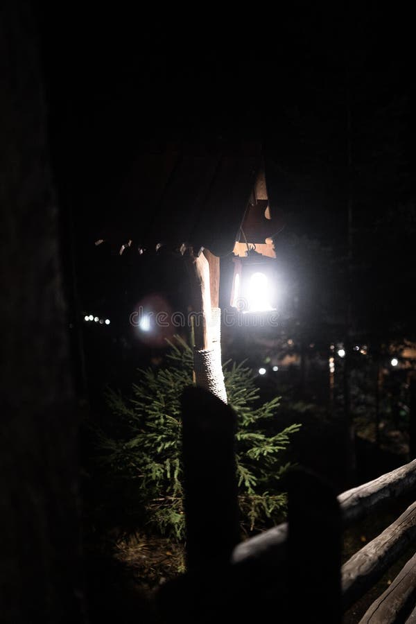 Old Lamp Made of Wood Chips Installed on Wooden Posts. an Ancient Lamp ...