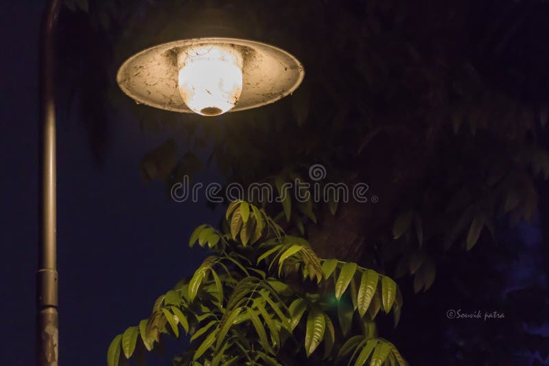 Old Lamp Post with White Yellow Light Illuminated at the Street Side ...