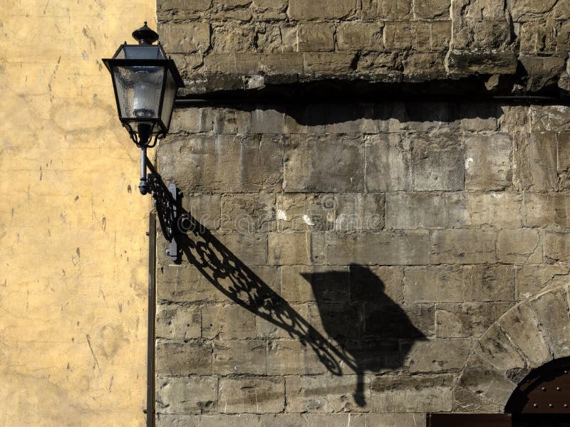Old Lantern Lamp with Shadow on Old Stone Wall Stock Image - Image of ...