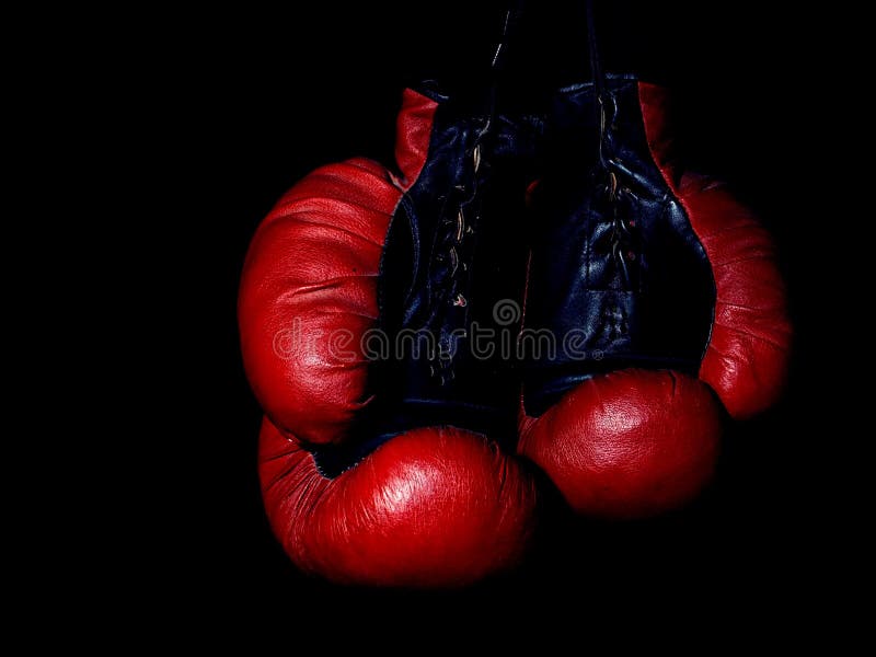 Old Leather Red Boxing Gloves Hanging in the Dark Stock Photo - Image ...