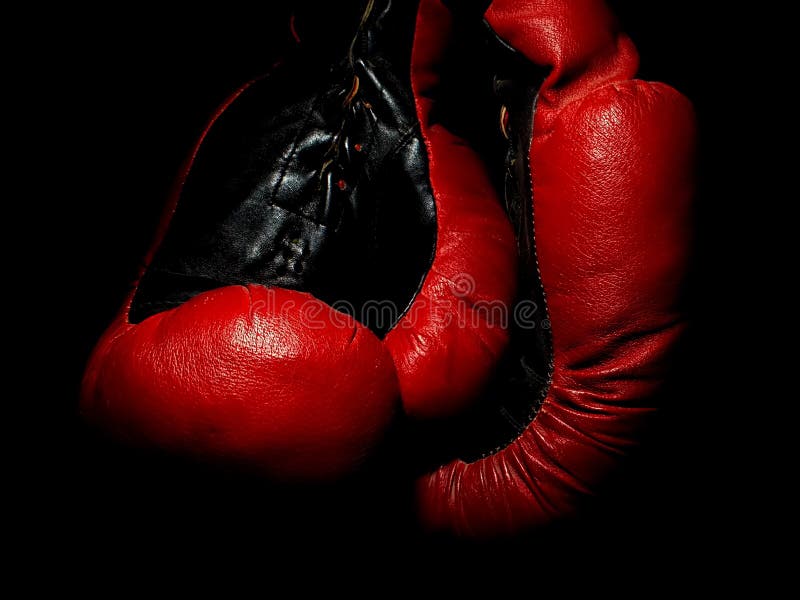 Old Leather Red Boxing Gloves Hanging in the Dark Stock Photo - Image ...