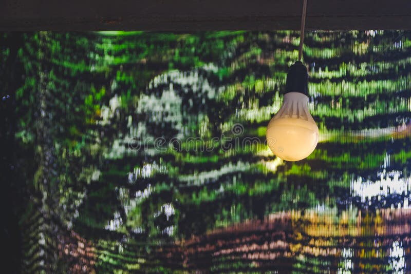 Old led light bulb on beam stock photo. Image of beam - 140715472