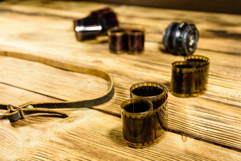 Old Lens and Films on Wooden Table Stock Photo - Image of light ...