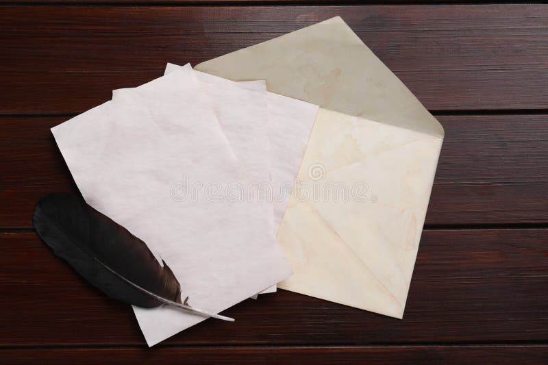 Old Letters, Envelope and Feather on Wooden Table, Top View Stock Photo ...