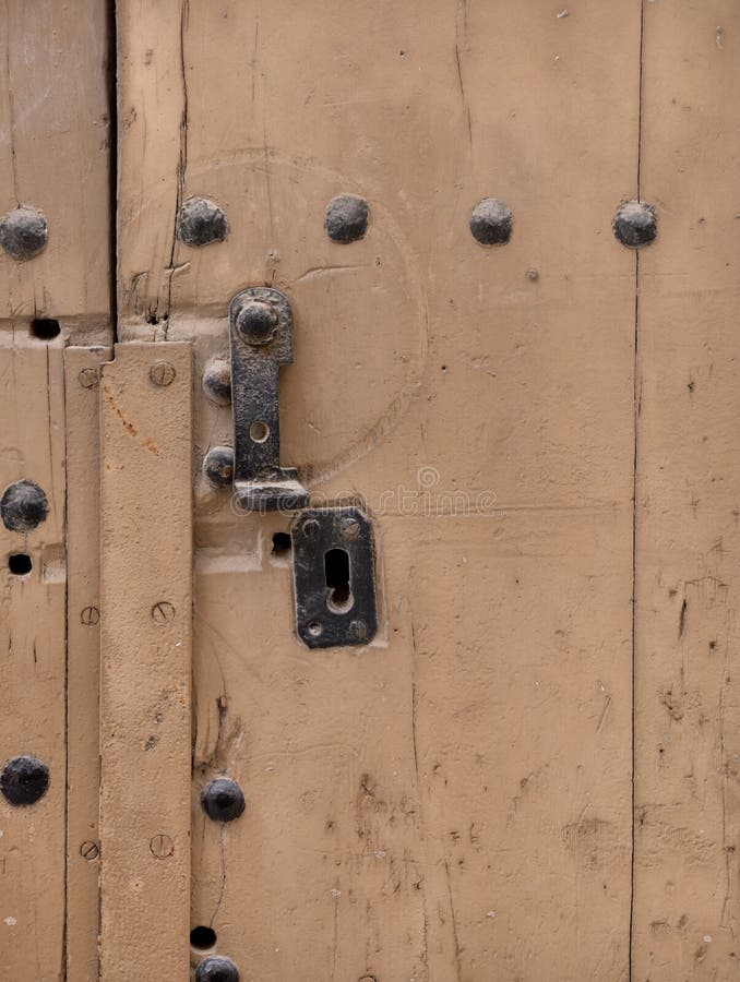 Old Light Brown Coated Wooden Gate with Metallic Door Hardware Stock ...