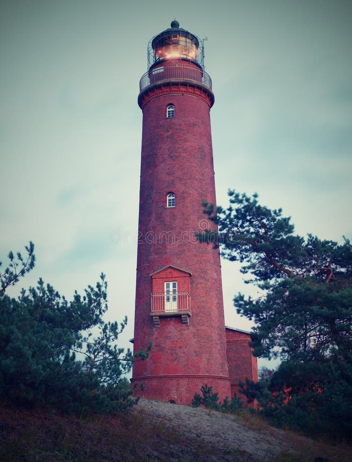 Old Lighthouse Above Dunes and Pine Tree before Sunset. Stock Photo ...