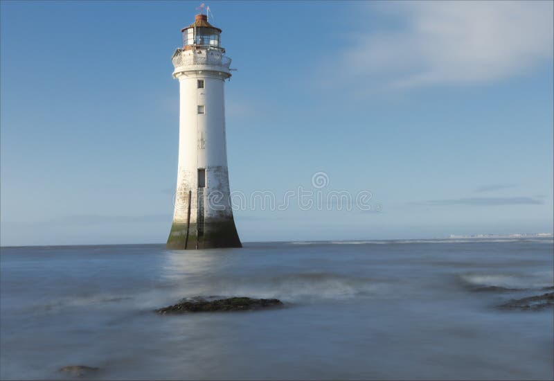 Old Lighthouse As the Tide Comes in Stock Image - Image of building ...