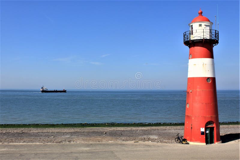 An Old Red and White Lighthouse in Westkapelle, Netherlands Stock Image ...