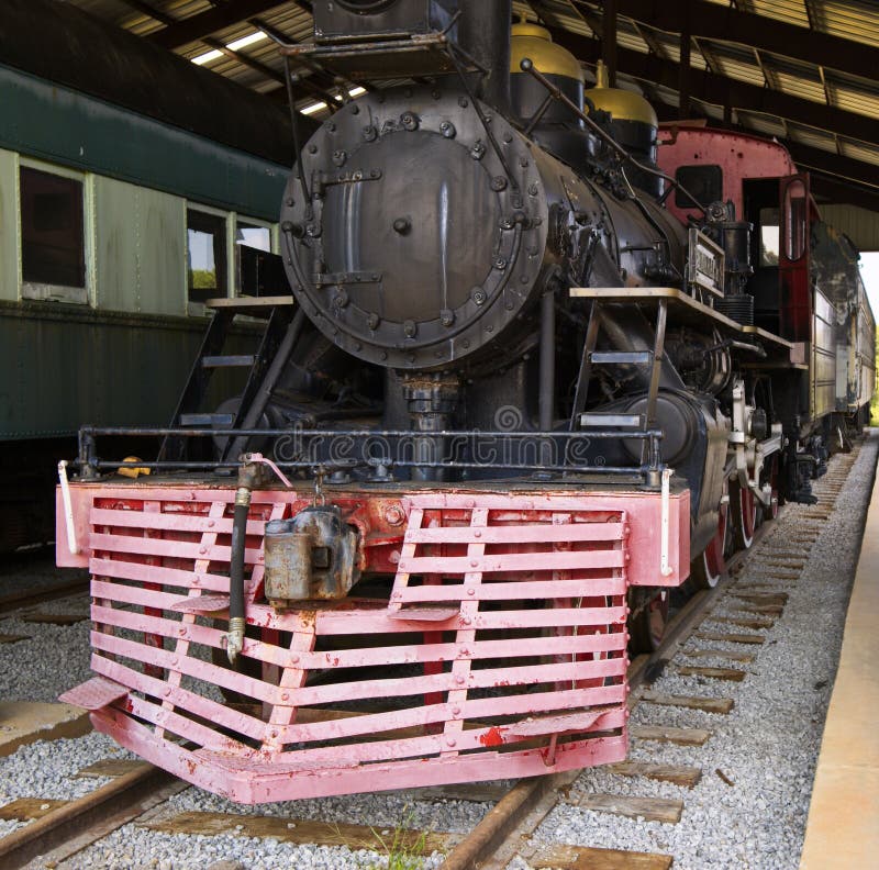 Old Locomotive on Tracks stock image. Image of oldfashioned - 163468397
