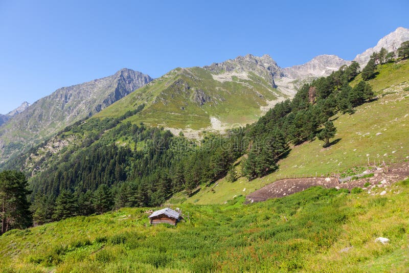 An Old Log Cabin in the Mountains of the Caucasus in Springtime. Stock ...