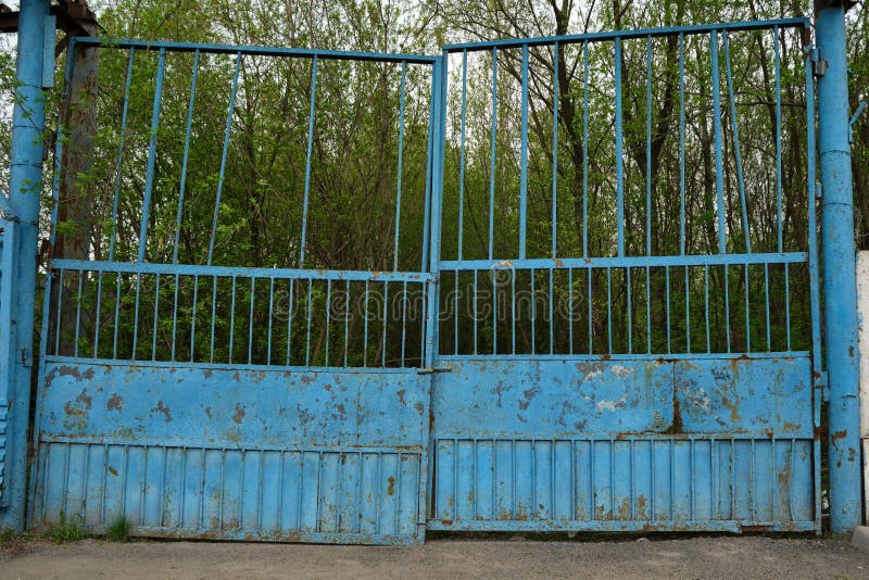 Old Rusty Iron Gates To Nowhere Stock Image - Image of iron, blue ...