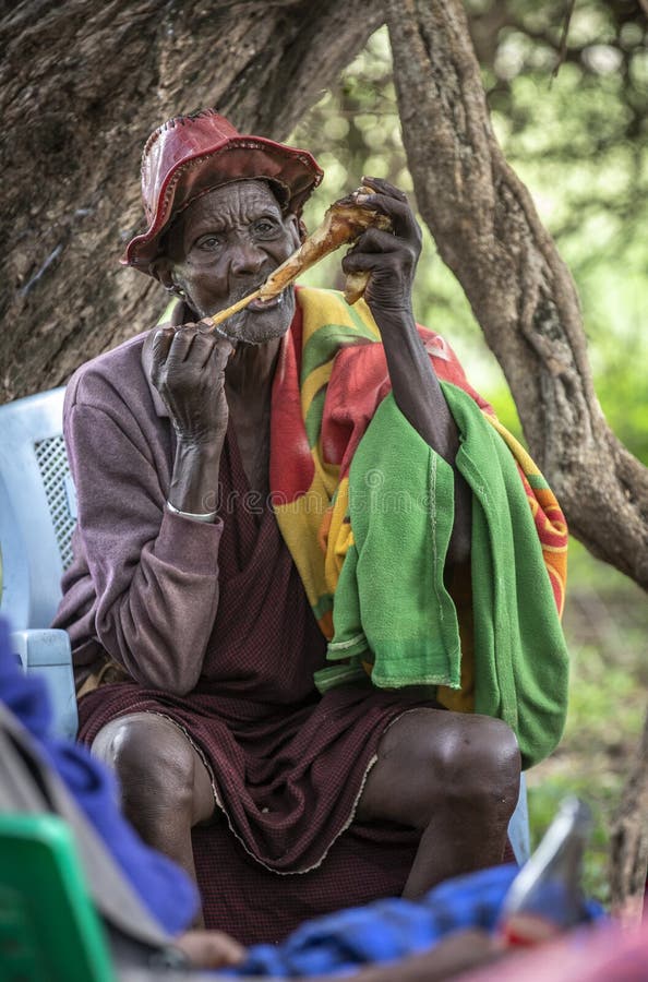 Old Maasai Man Chewing a Bone Editorial Image - Image of kenya, male ...