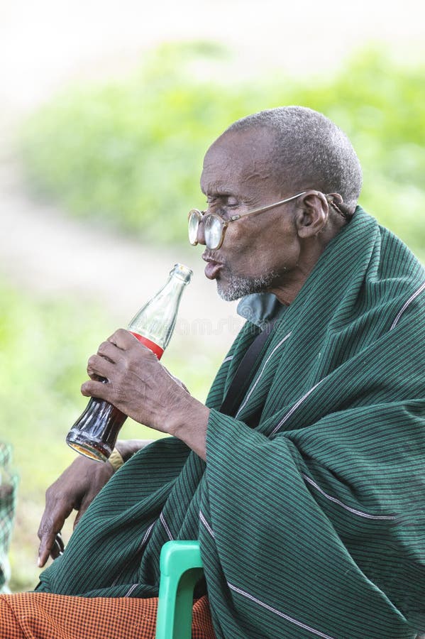 Old Maasai Man Drinking a Soda Editorial Stock Image - Image of ...