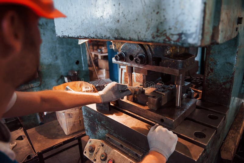 Old Machine. Man in Uniform Works on the Production Stock Photo - Image ...