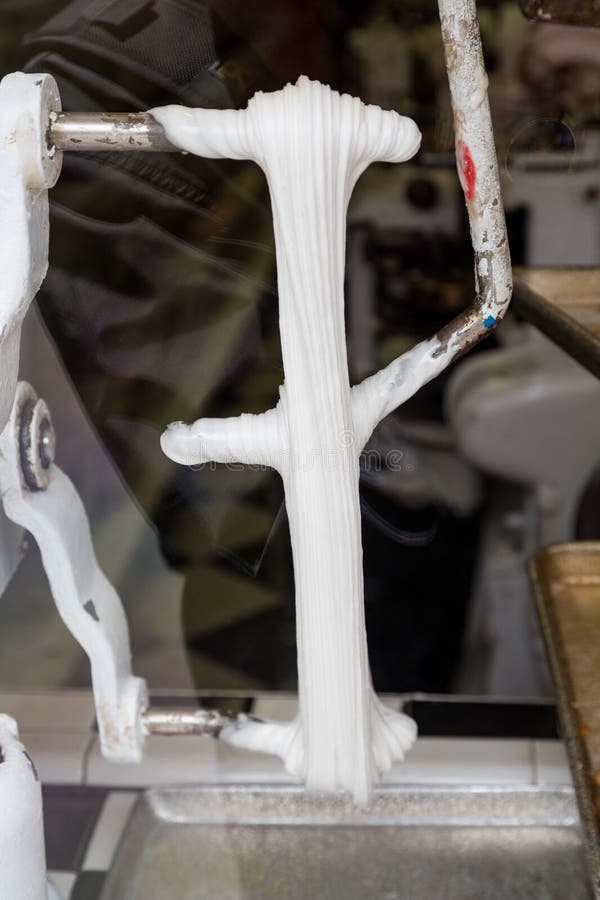 Old Machine Pulling Taffy stock photo. Image of pulling - 83476704