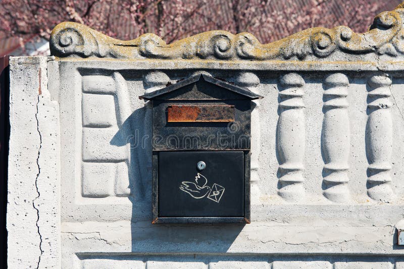 Old Mail Box for Letters with Metal Box with Rust Hanging on Fence on ...