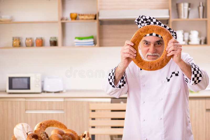 The Old Male Baker Working in the Kitchen Stock Photo - Image of loaf ...