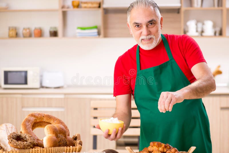 The Old Male Baker Working in the Kitchen Stock Photo - Image of ...