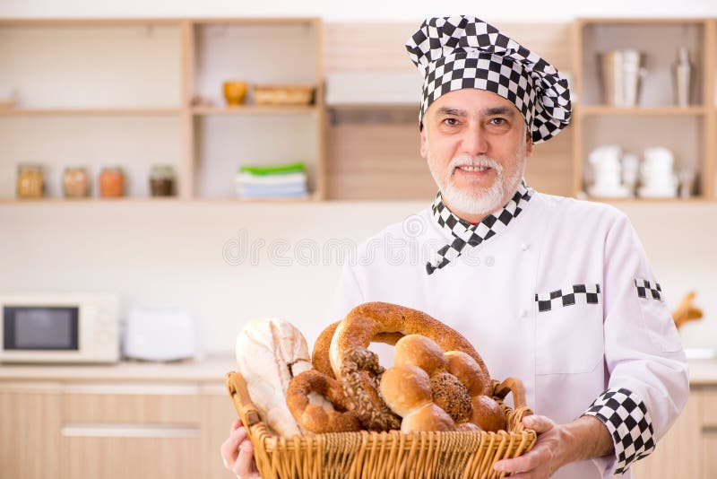 The Old Male Baker Working in the Kitchen Stock Photo - Image of baking ...
