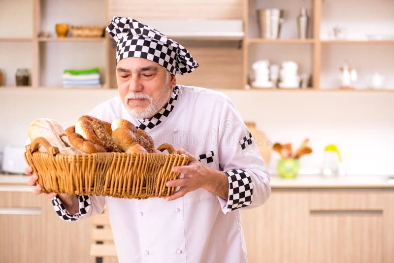 The Old Male Baker Working in the Kitchen Stock Photo - Image of ...