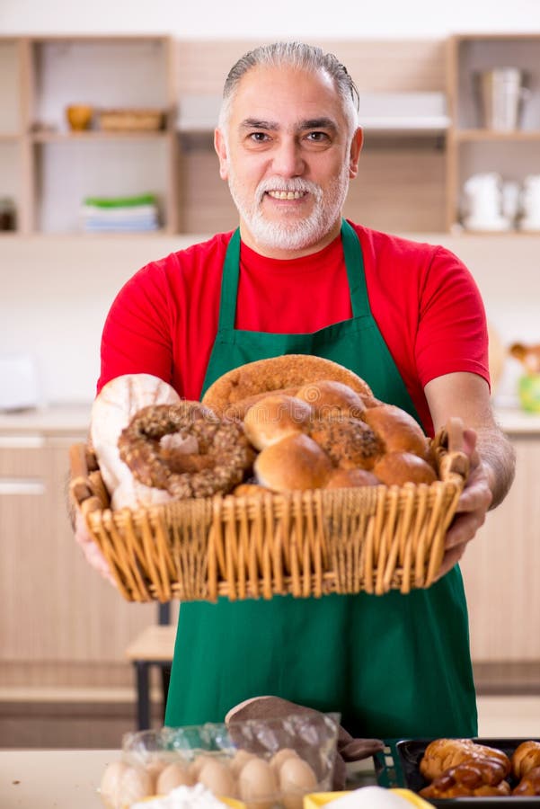 The Old Male Baker Working in the Kitchen Stock Photo - Image of cake ...