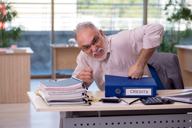 Old Male Bookkeeper Unhappy with Excessive Work at Workplace Stock ...