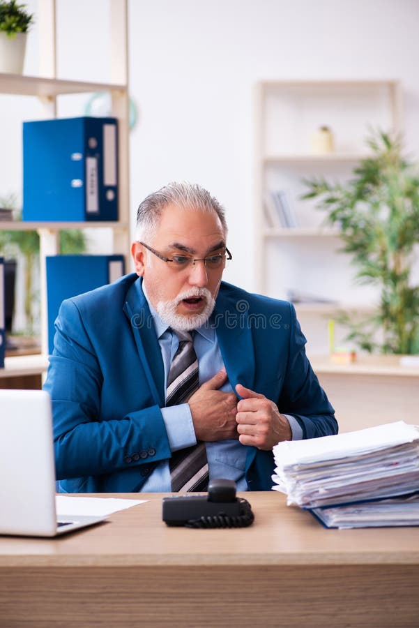 Old Male Bookkeeper Unhappy with Excessive Work at Workplace Stock ...