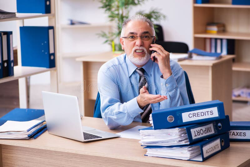 Old Male Bookkeeper Unhappy with Excessive Work at Workplace Stock ...