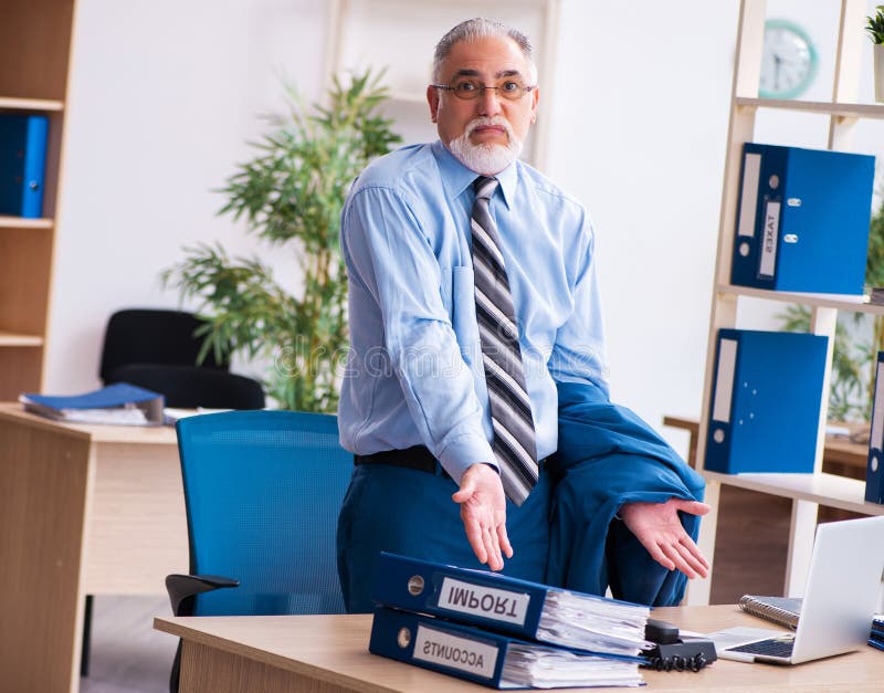 Old Male Bookkeeper Unhappy with Excessive Work at Workplace Stock ...