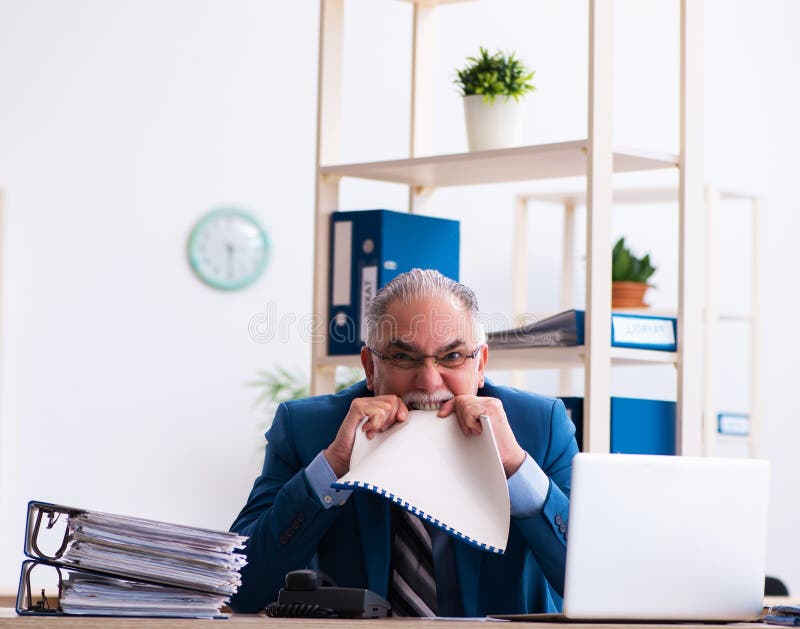 Old Male Bookkeeper Unhappy with Excessive Work at Workplace Stock ...