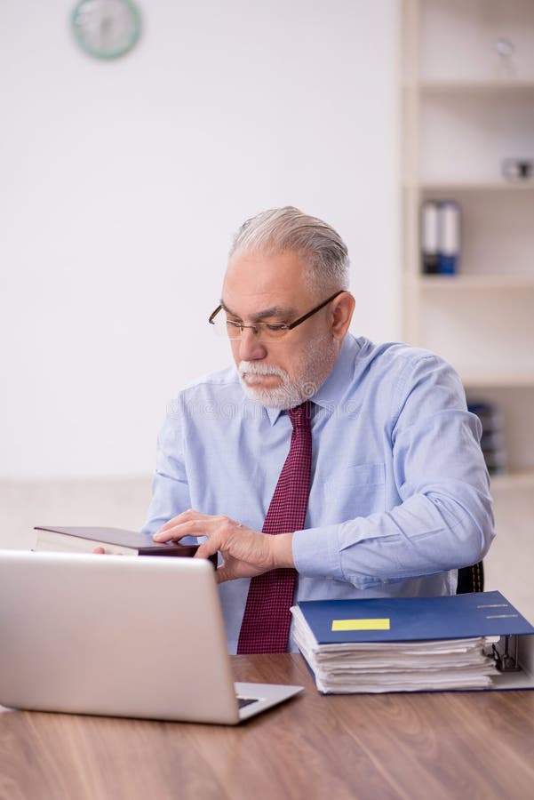 Old Male Boss Reading Book at Workplace Stock Photo - Image of boss ...