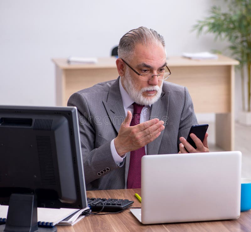 Old Male Boss Sitting at Desktop in the Office Stock Photo - Image of ...