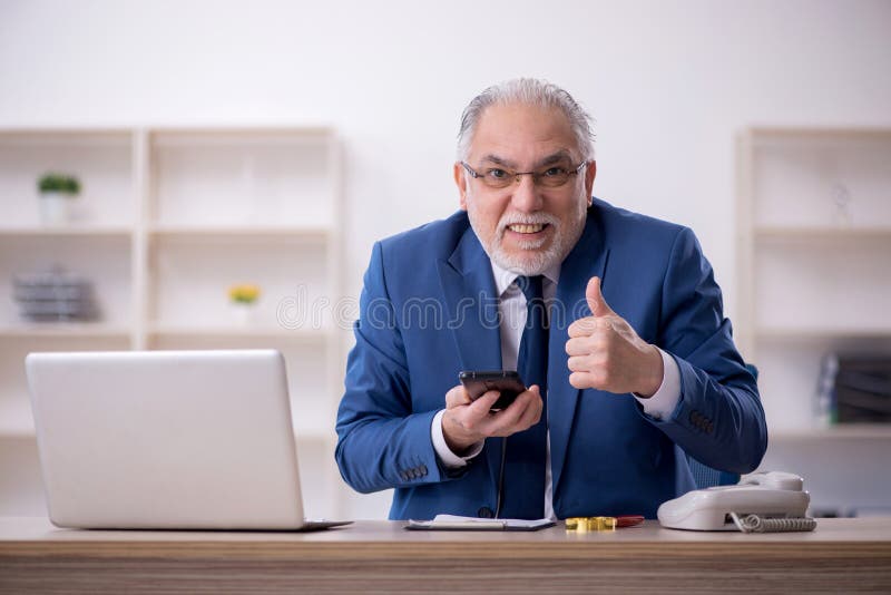 Old Male Boss Working at Workplace Stock Image - Image of video ...