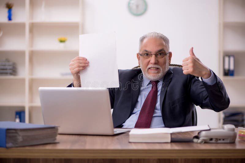 Old Male Boss Working at Workplace Stock Photo - Image of document ...