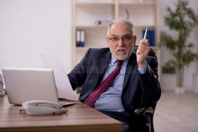 Old Male Boss Working at Workplace Stock Photo - Image of aged, overdue ...