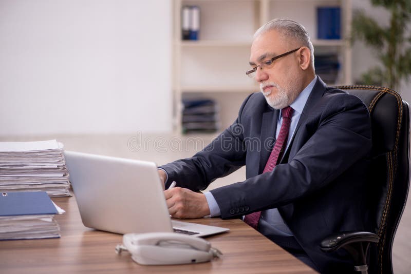 Old Male Boss Working at Workplace Stock Photo - Image of writing ...