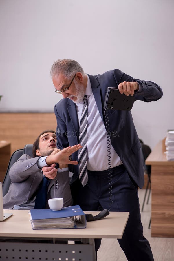 Old Boss and Young Male Assistant in the Office Stock Photo - Image of ...