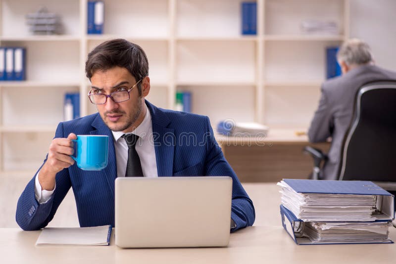 Old Male Boss and Young Male Employee in the Office Stock Image - Image ...