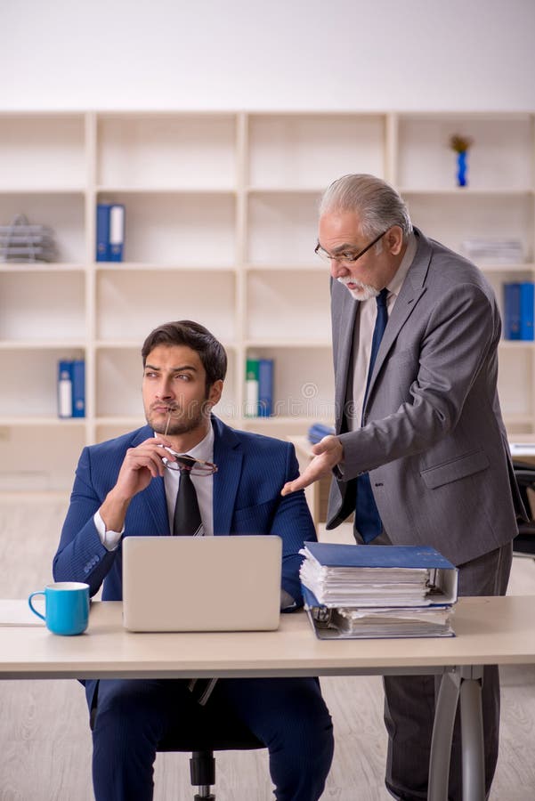 Old Male Boss and Young Male Employee in the Office Stock Photo - Image ...